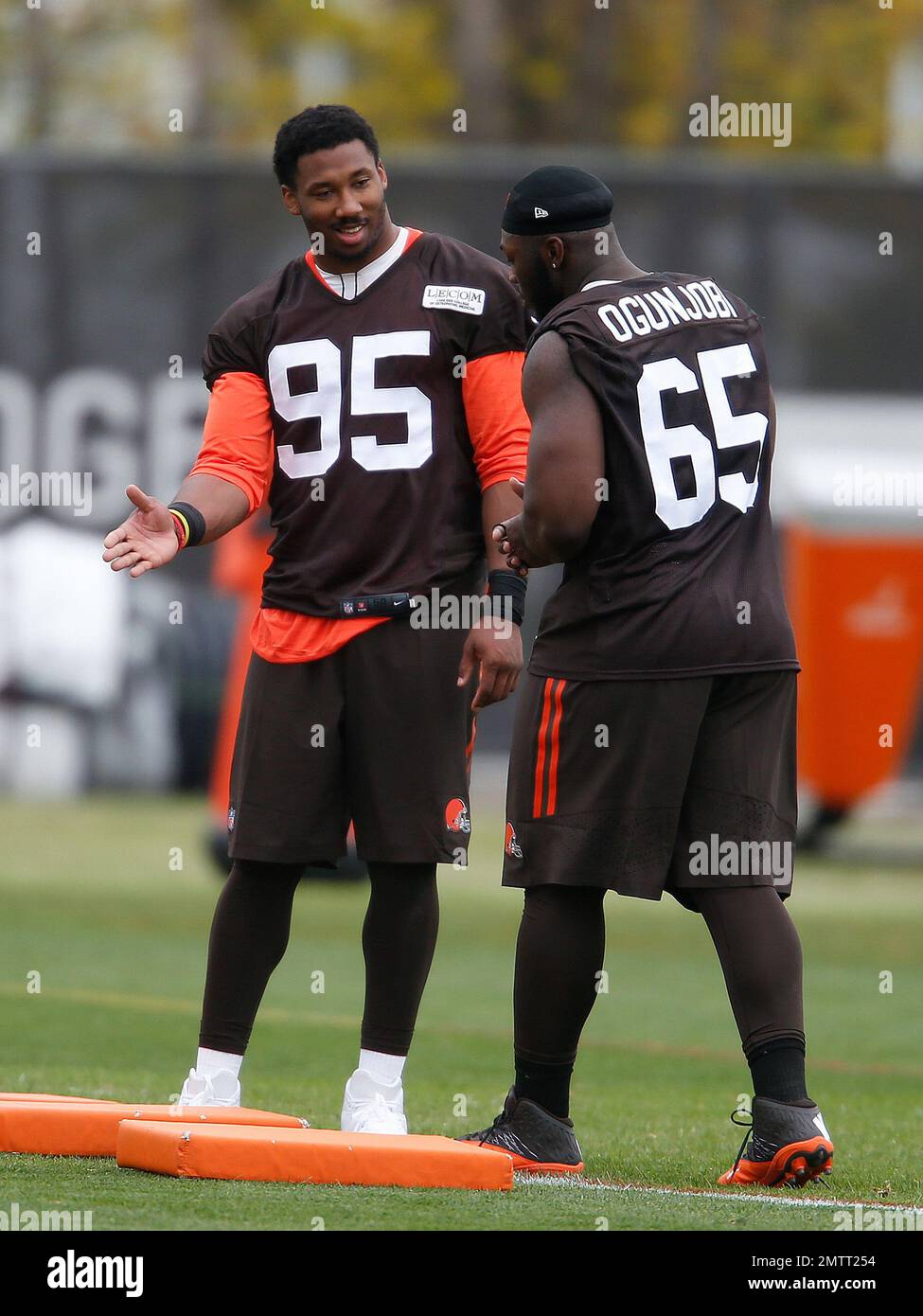 Cleveland Browns' Myles Garrett and Larry Ogunjobi talk after practice ...