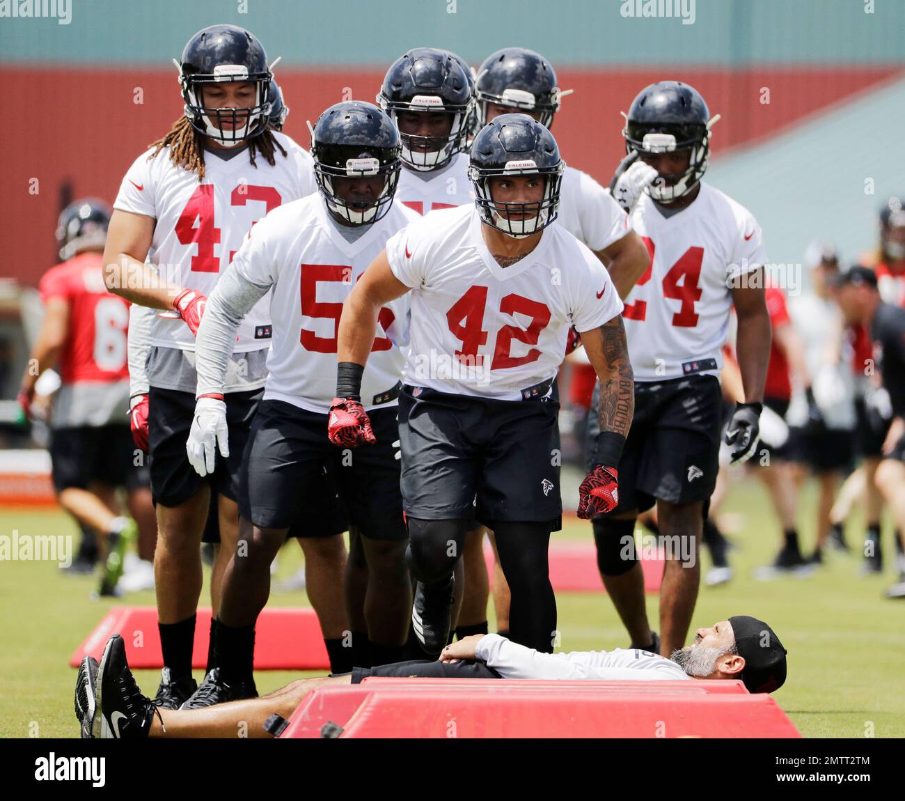 Atlanta Falcons' Duke Riley, center, runs a drill during the team's NFL ...