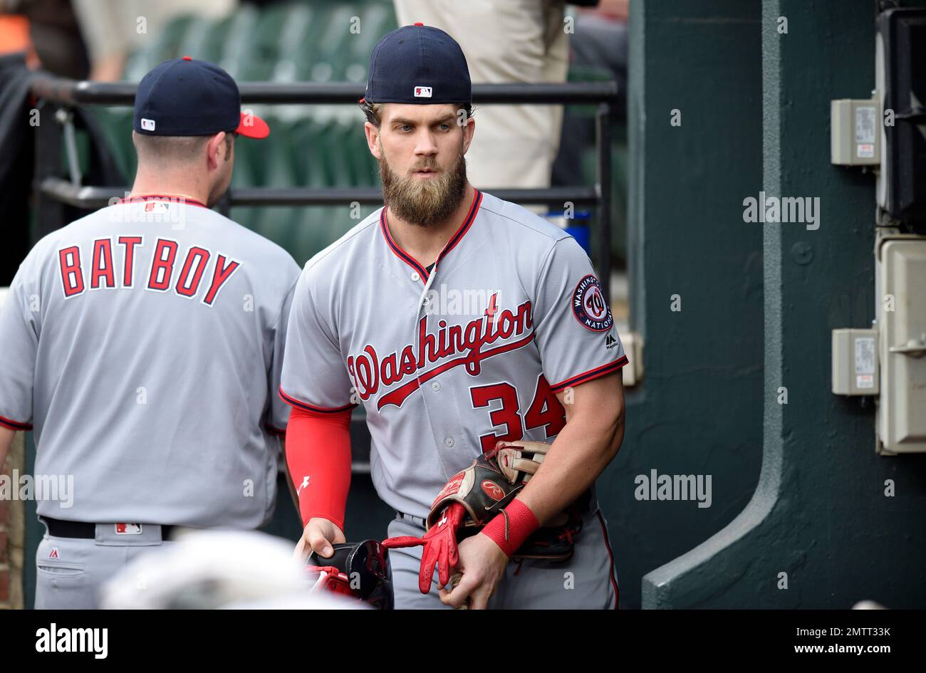 Washington Nationals' Bryce Harper walks in the dugout before an ...