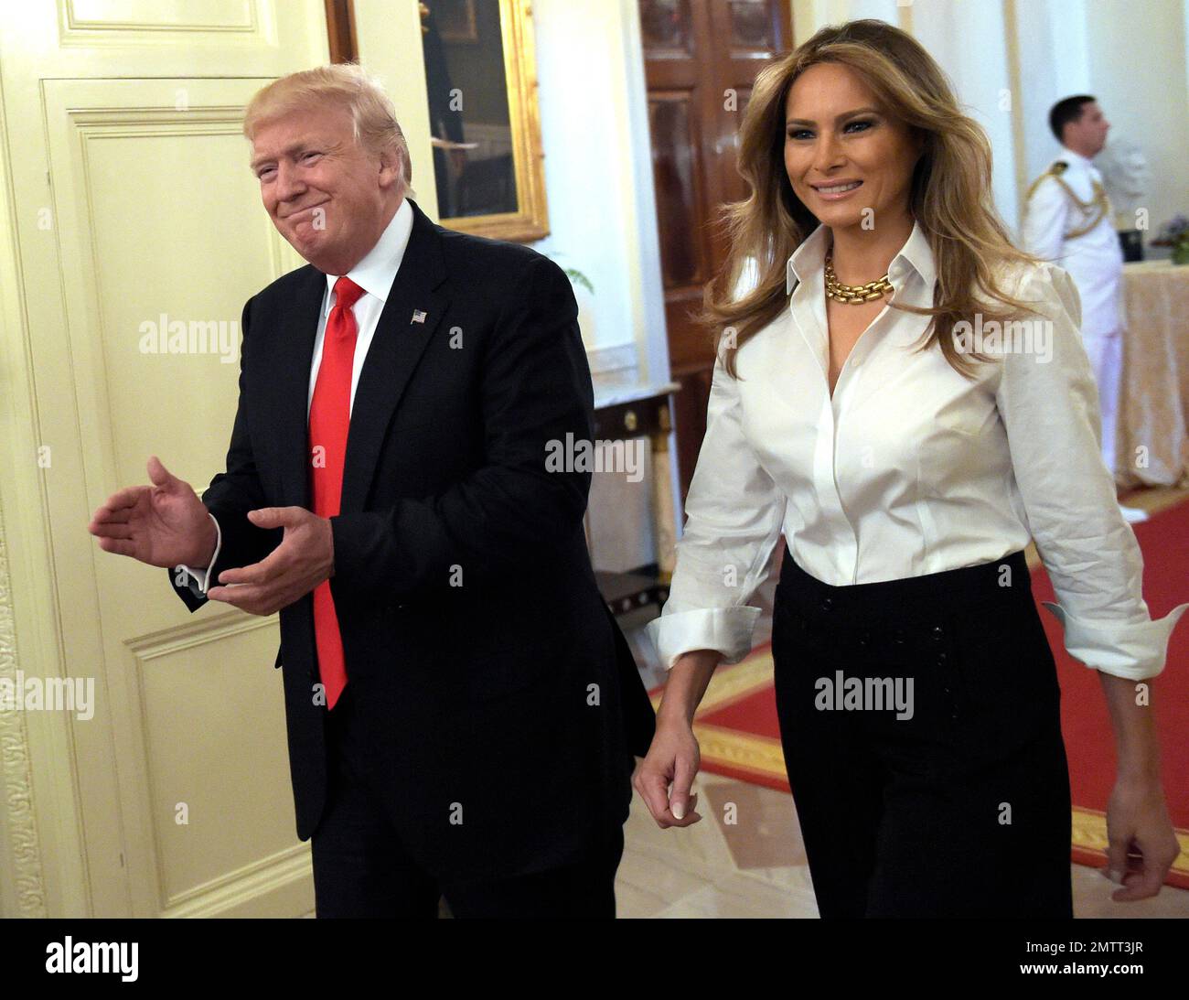 President Donald Trump and first lady Melania Trump arrive in the East ...