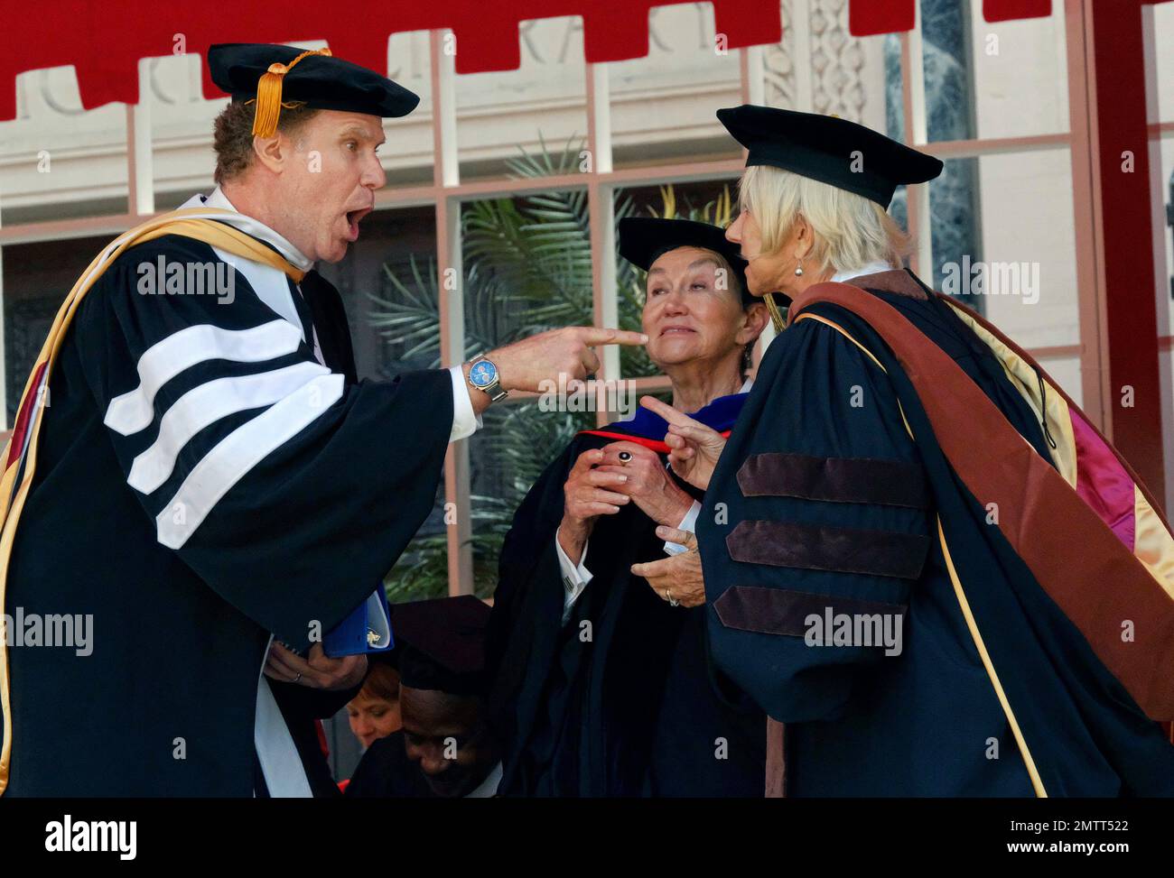 Actor Will Ferrell, left greets actress Helen Mirren while Elizabeth ...