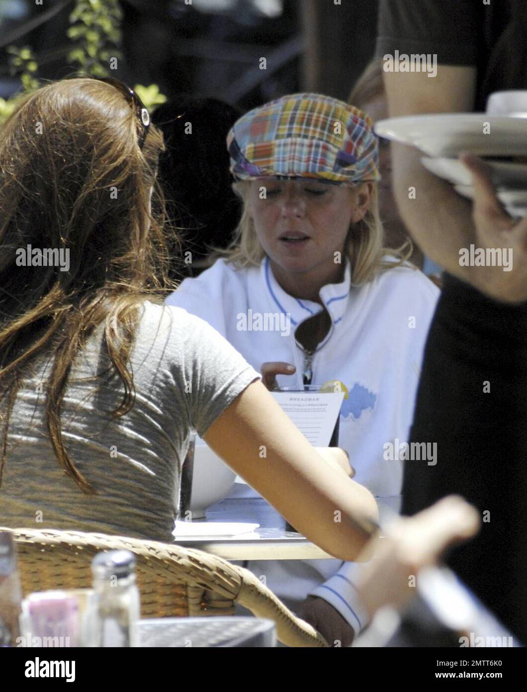Tara Reid and a friend grab a bite at The Bread Bar. Tara is wearing ...