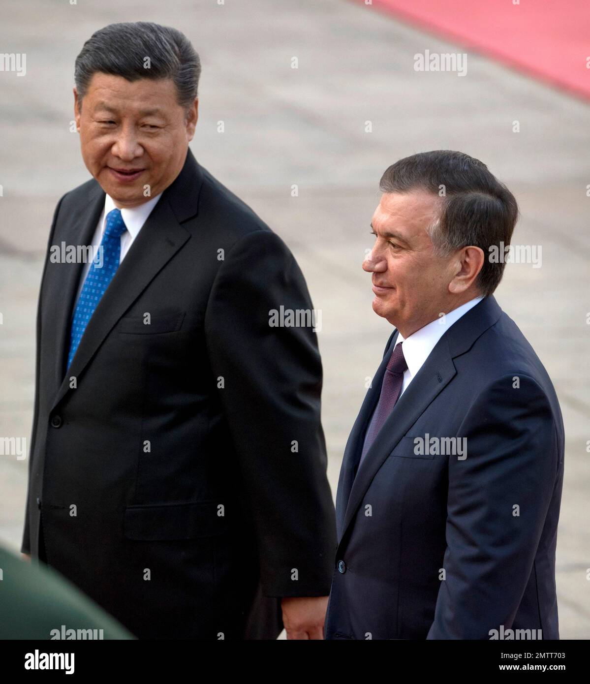 Chinese President Xi Jinping, left, and Uzbek President Shavkat ...