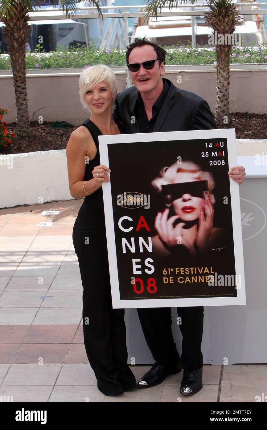 Quentin Tarantino poses for photos before presenting a cinema ...