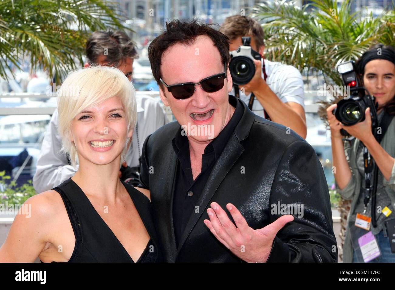 Quentin Tarantino poses for photos before presenting a cinema ...