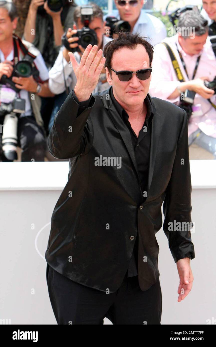 Quentin Tarantino poses for photos before presenting a cinema ...