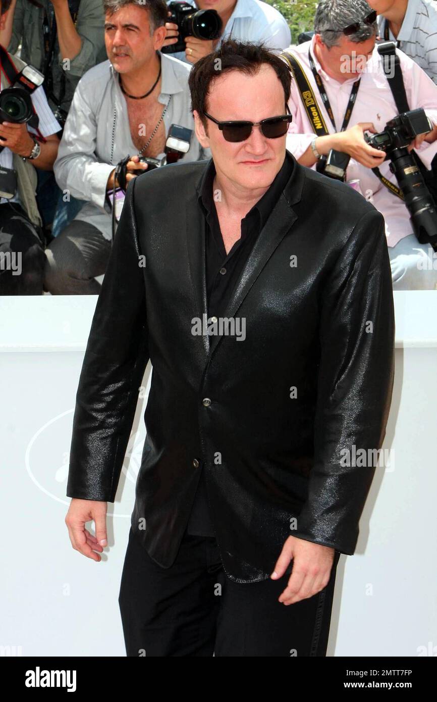 Quentin Tarantino poses for photos before presenting a cinema ...