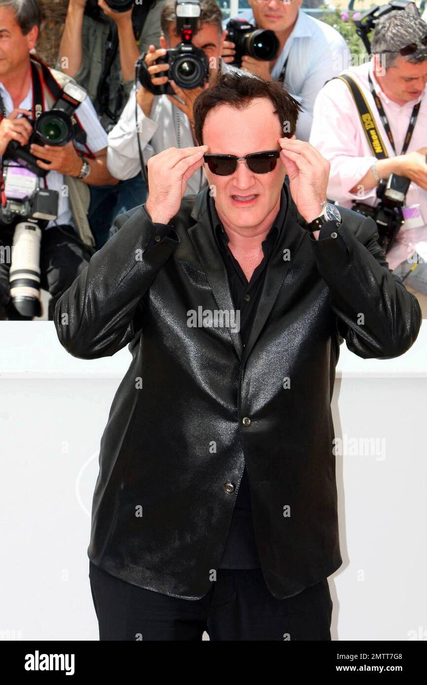 Quentin Tarantino poses for photos before presenting a cinema ...