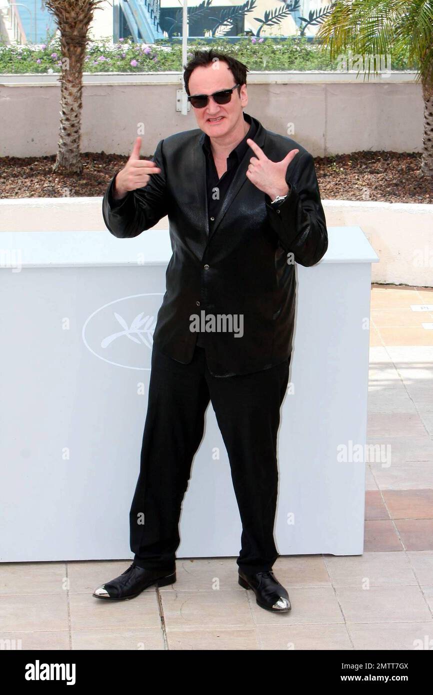 Quentin Tarantino poses for photos before presenting a cinema ...