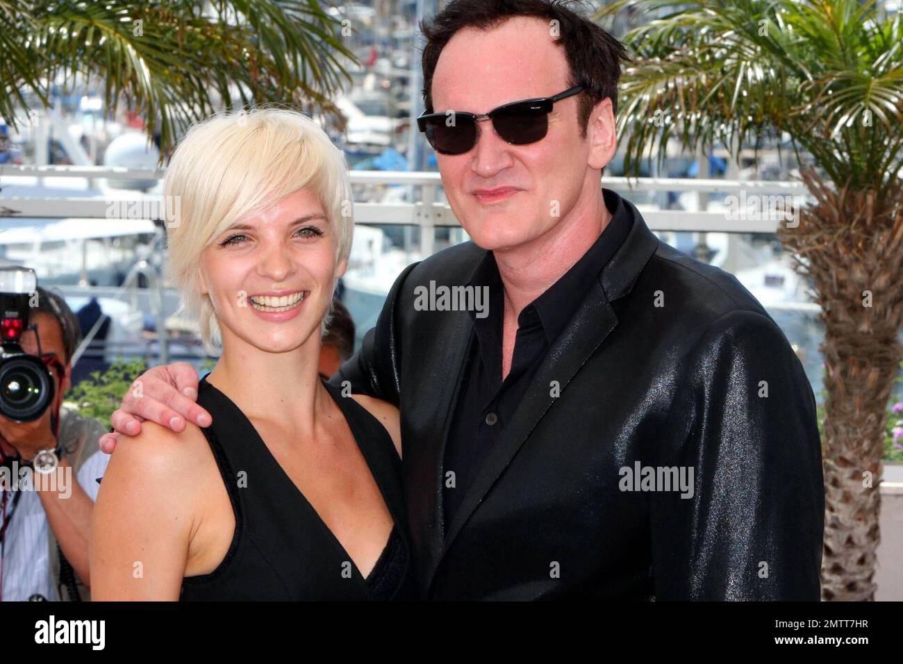 Quentin Tarantino poses for photos before presenting a cinema ...