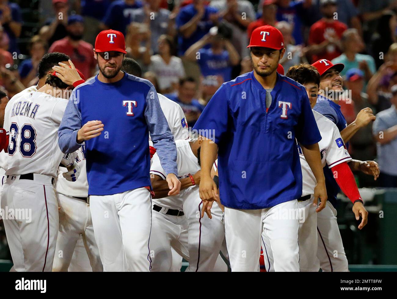Texas Rangers' Cole Hamels, left, and Yu Darvish, right, head to the ...