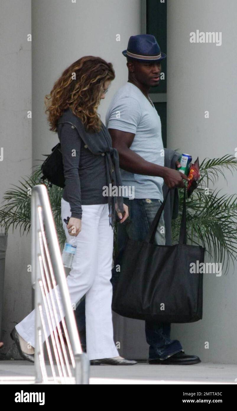 Taye Diggs carries along a soda and a snack as he leaves the "Chelsea ...