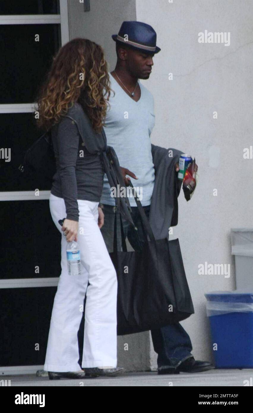 Taye Diggs carries along a soda and a snack as he leaves the "Chelsea ...