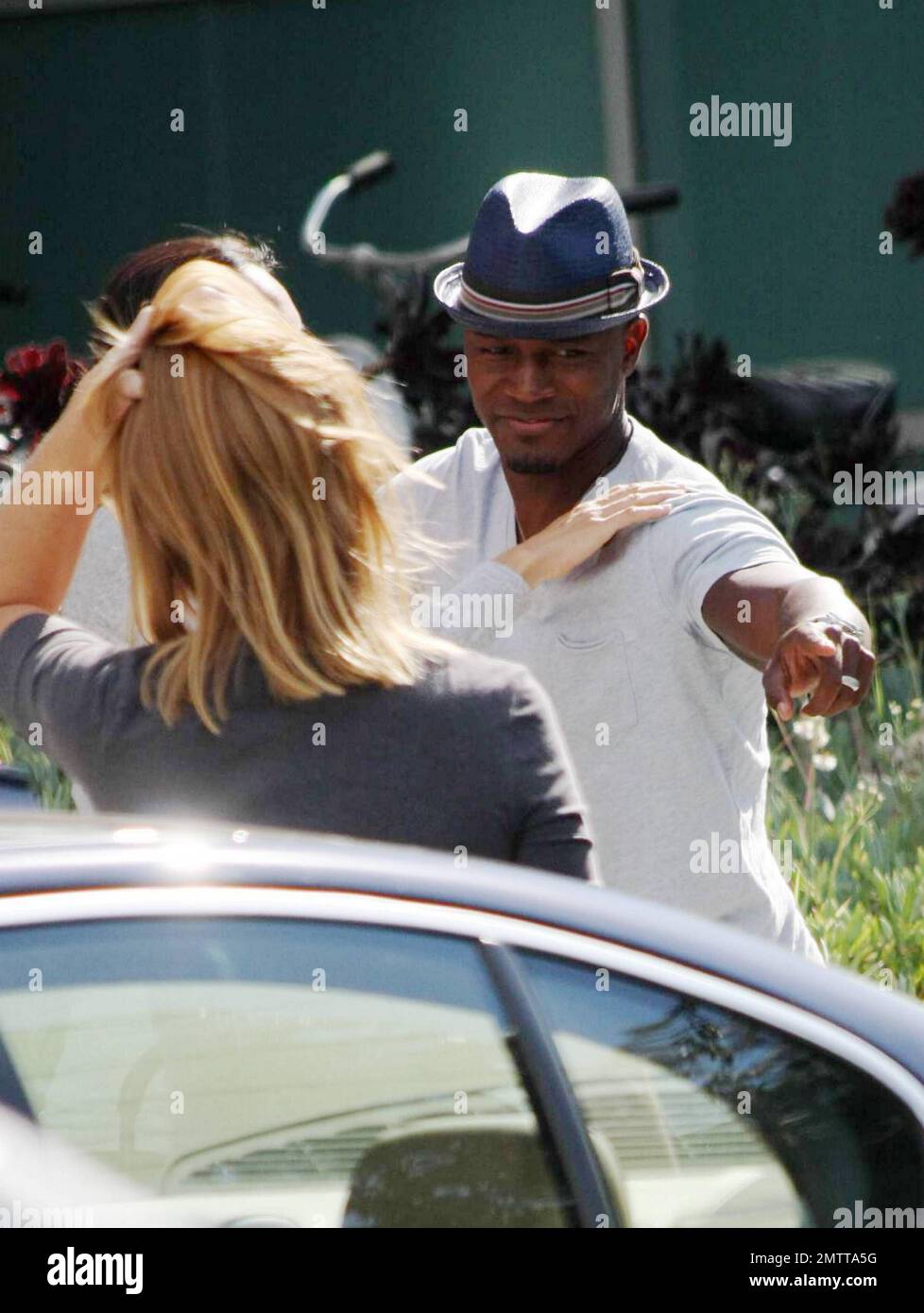 Taye Diggs carries along a soda and a snack as he leaves the "Chelsea ...