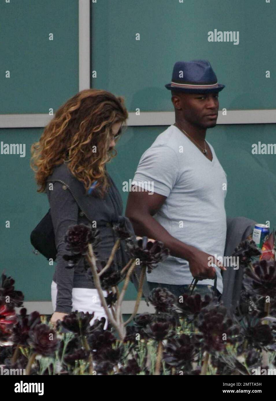 Taye Diggs carries along a soda and a snack as he leaves the "Chelsea ...