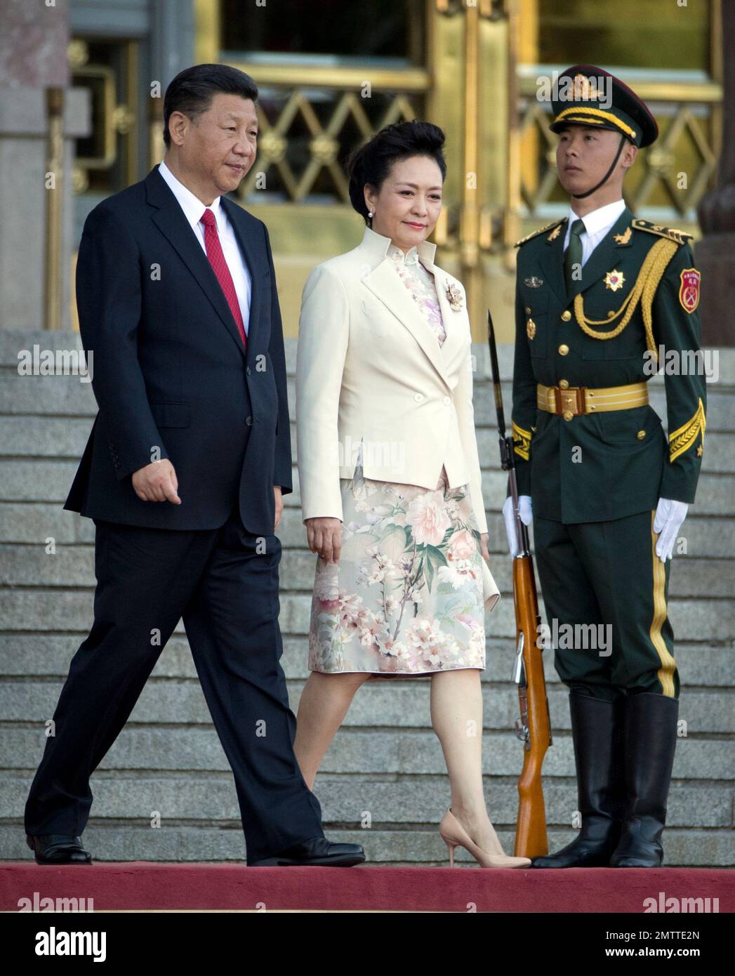 Chinese President Xi Jinping, left, and first lady Peng Liyuan arrive ...