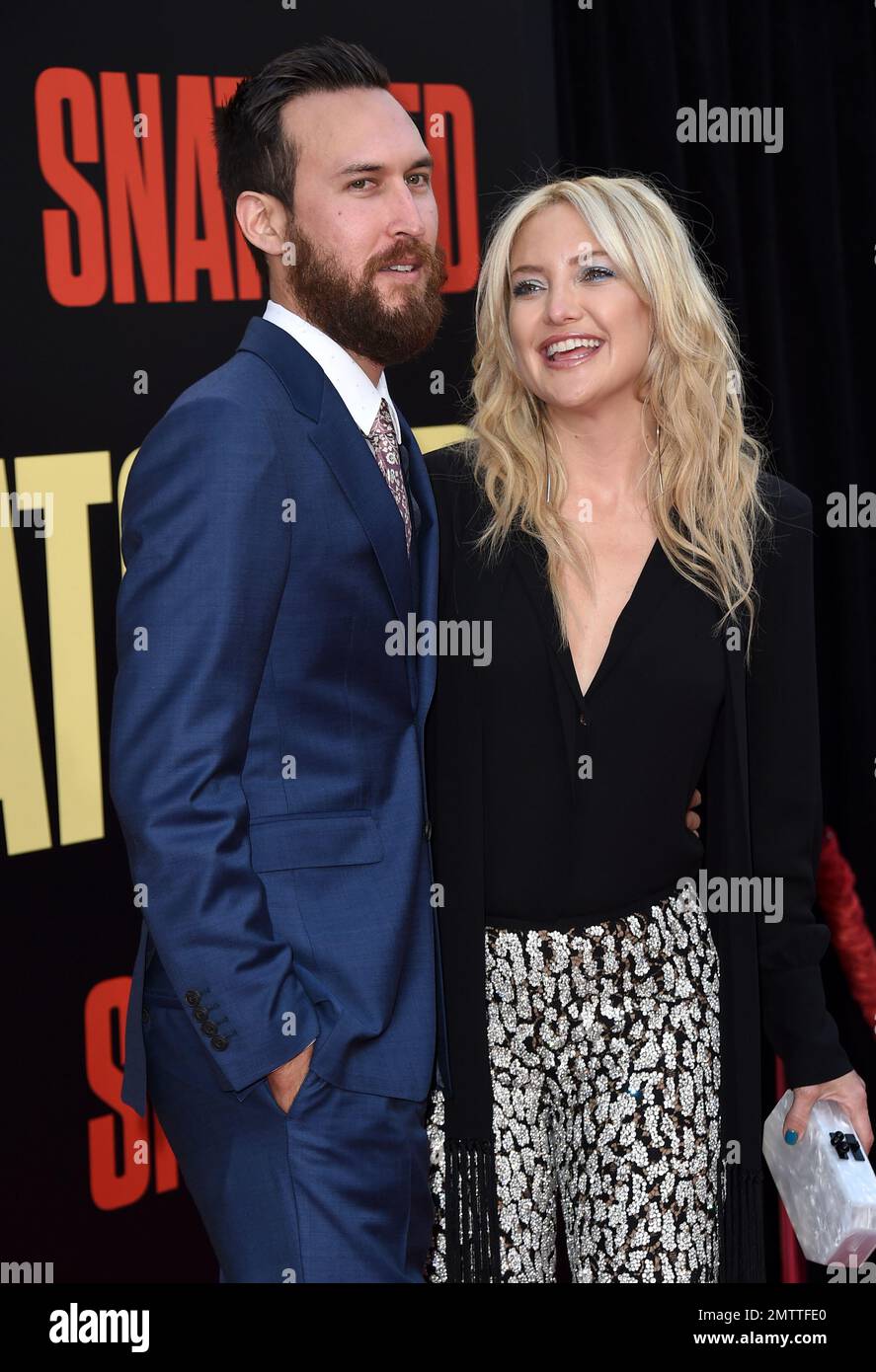 Danny Fujikawa, left, and Kate Hudson arrive at the Los Angeles ...