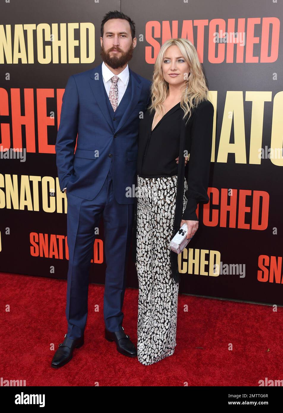 Danny Fujikawa, left, and Kate Hudson arrive at the Los Angeles ...