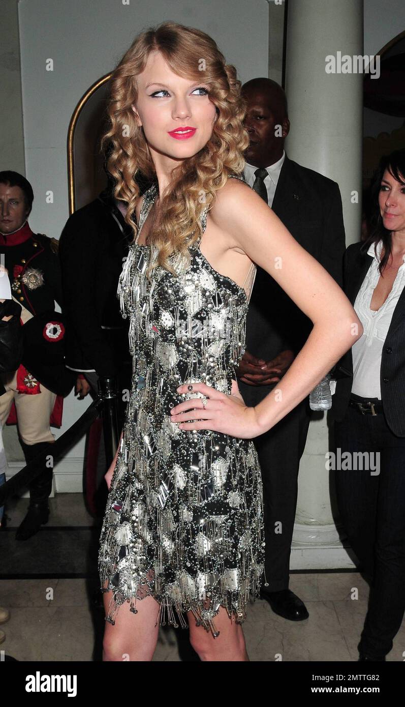 Wearing the same dress as her new likeness, country music superstar ...