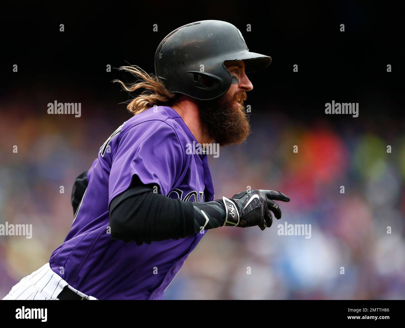 Colorado Rockies' Charlie Blackmon runs against the Chicago Cubs during ...