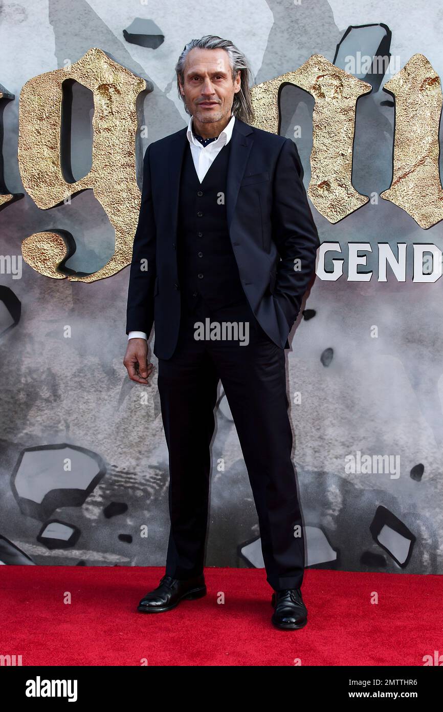 Actor Rob Knighton poses for photographers on arrival at the premiere ...