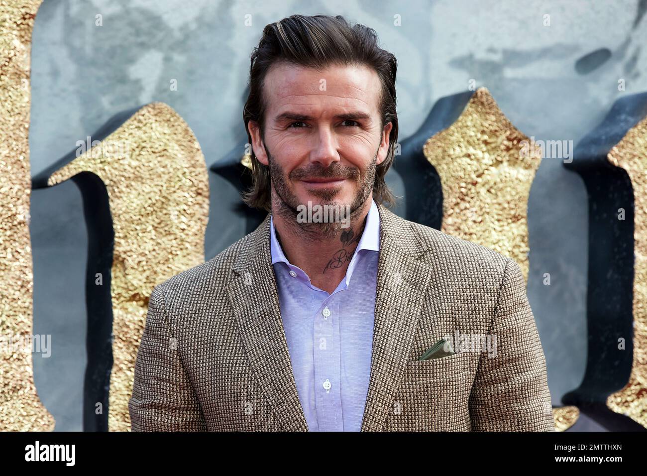 Actor David Beckham poses for photographers on arrival at the premiere ...