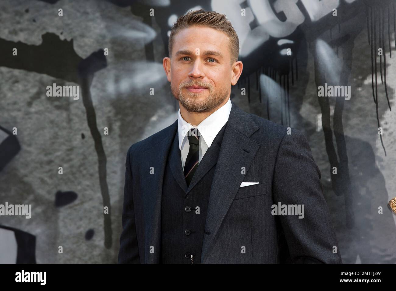 Actor Charlie Hunnam poses for photographers on arrival at the premiere ...