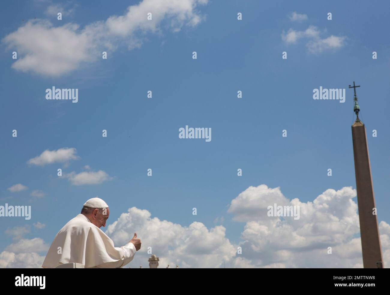 Pope Francis gives the thumb up sign as he leaves St. Peter's Square at ...
