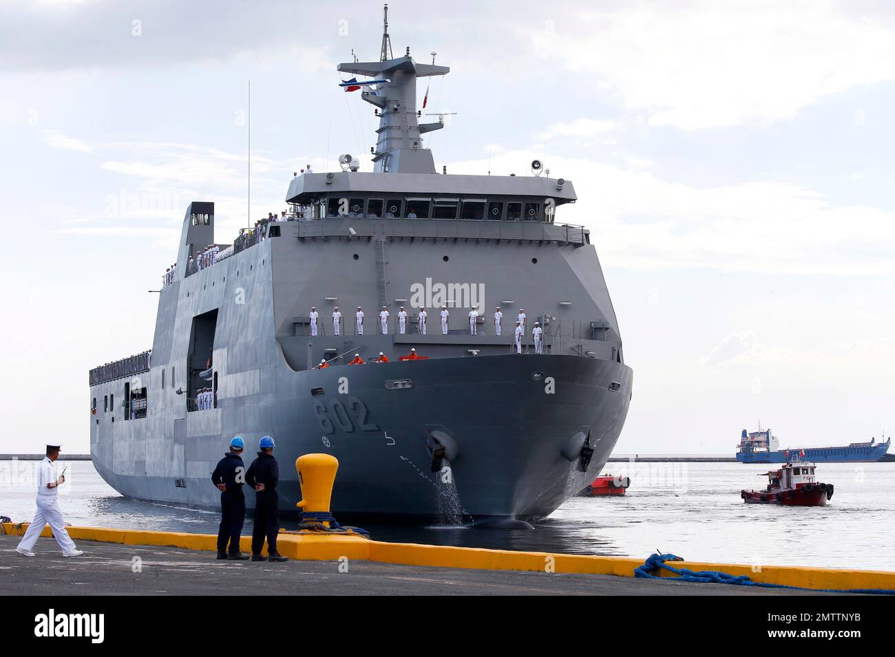 Philippine Navy crew watch as its new ship named BRP Davao del Sur ...