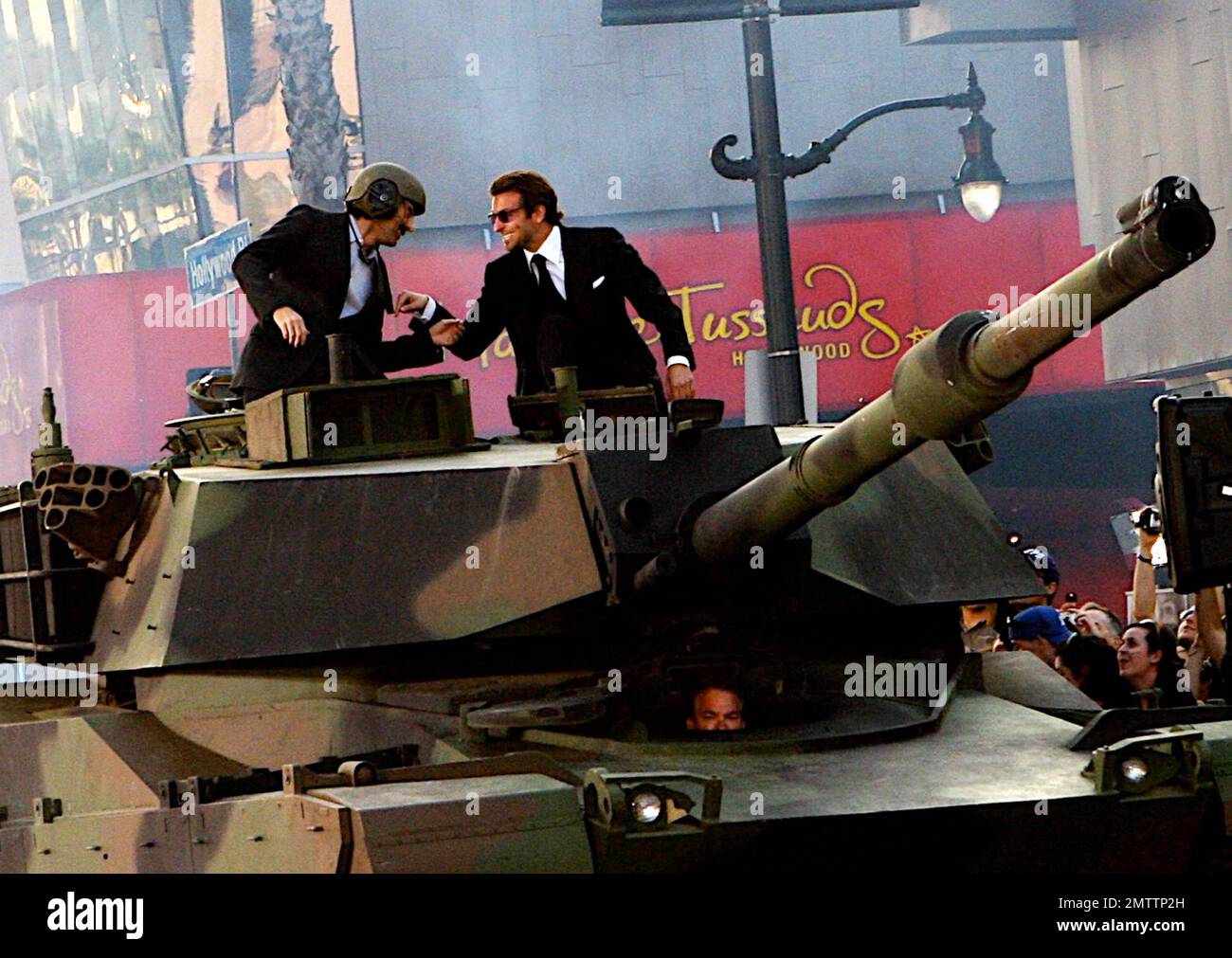 Bradley Cooper and Sharlto Copley arrive on a tank to the premiere of ...