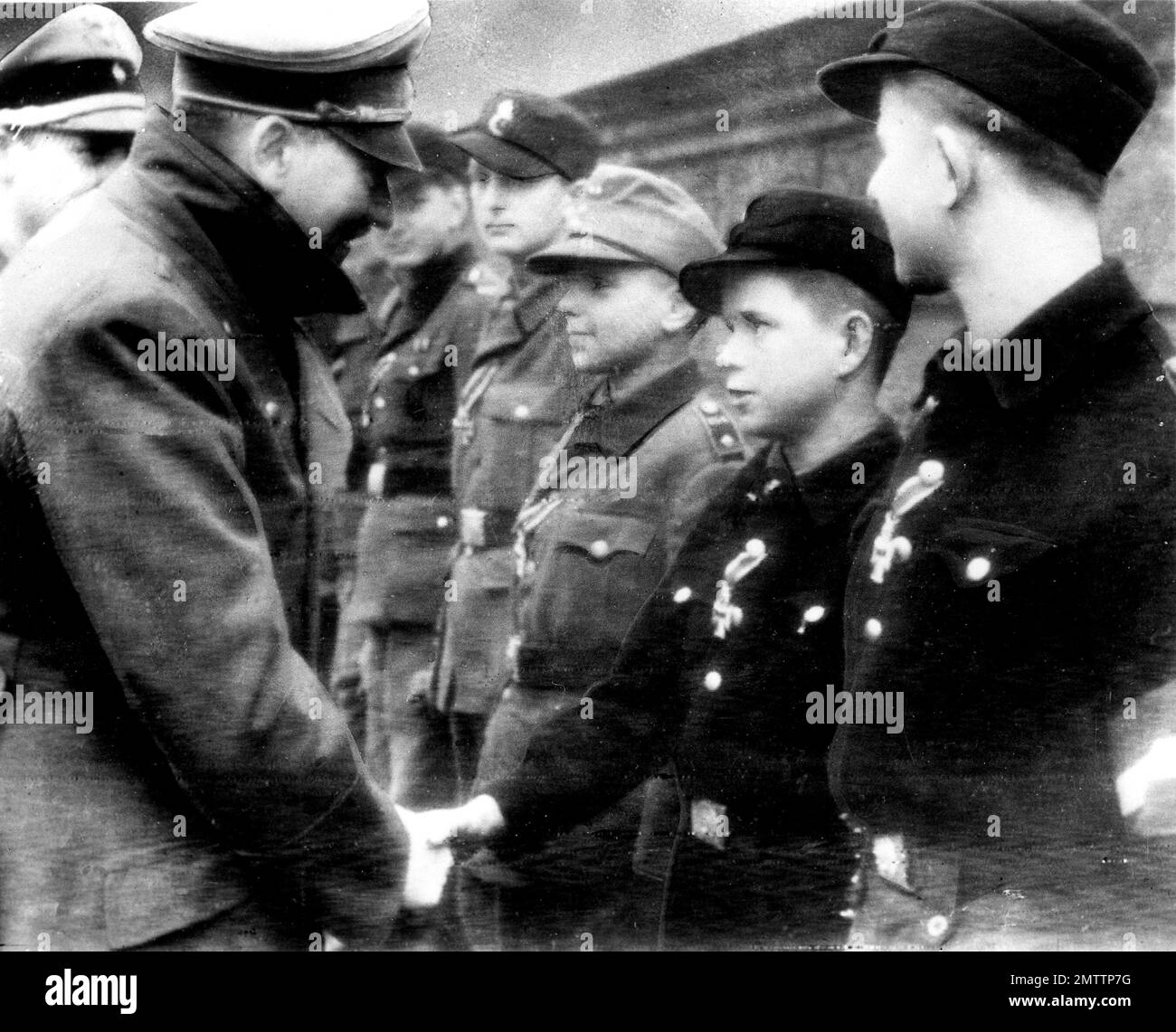Adolf Hitler, left, shakes hands with 12-year-old Alfred Czech, a ...