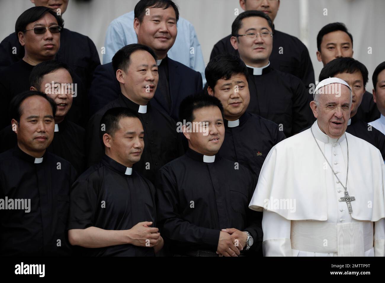 Pope Francis poses for a photo with a group of Chinese priests during ...