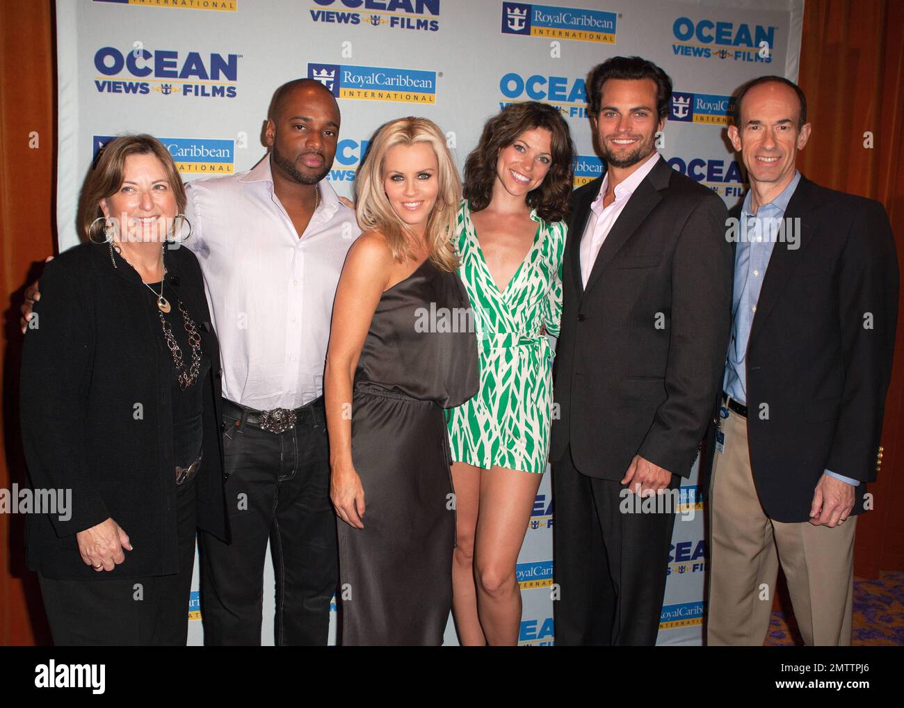 Looking fabulous in a flattering and demure grey dress Jenny McCarthy ...
