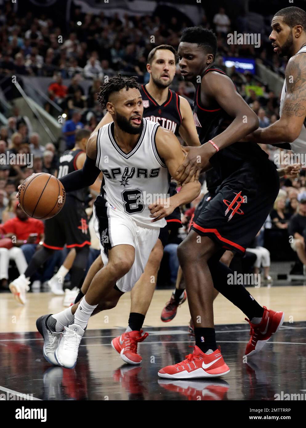 San Antonio Spurs guard Patty Mills (8) handles the ball on the ...