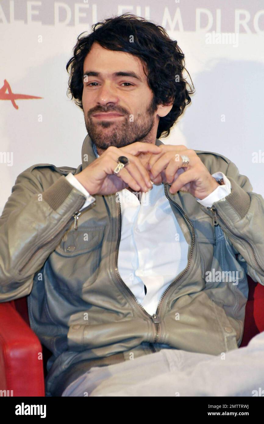 Romain Duris has fun as he poses for photographers at the photo call ...