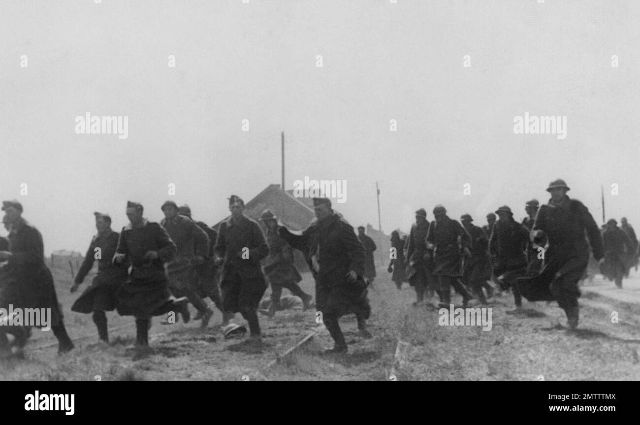 In this photo taken by a German photographer, Belgian soldiers run ...