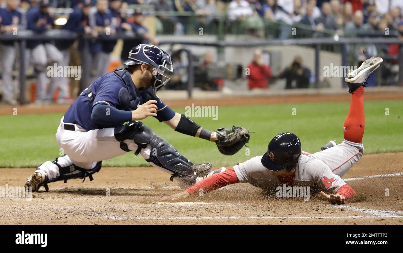 Boston Red Sox's Chase d'Arnaud slides safely past Milwaukee Brewers ...