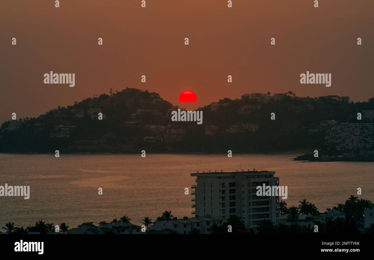 An aerial view of the beautiful bright sunset over the Manzanillo beach ...