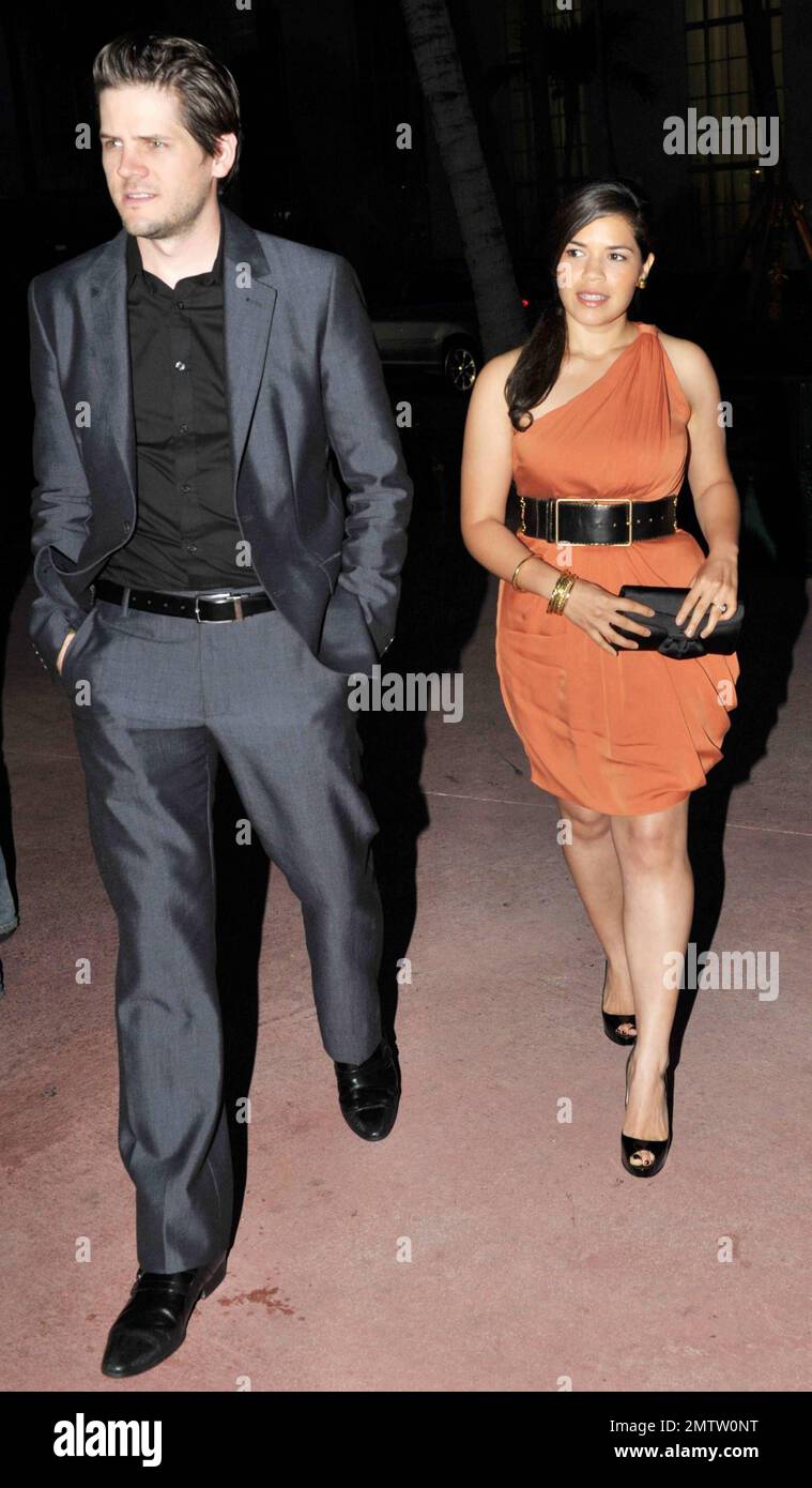 Clad in a flattering orange cocktail dress and wide belt, actress ...