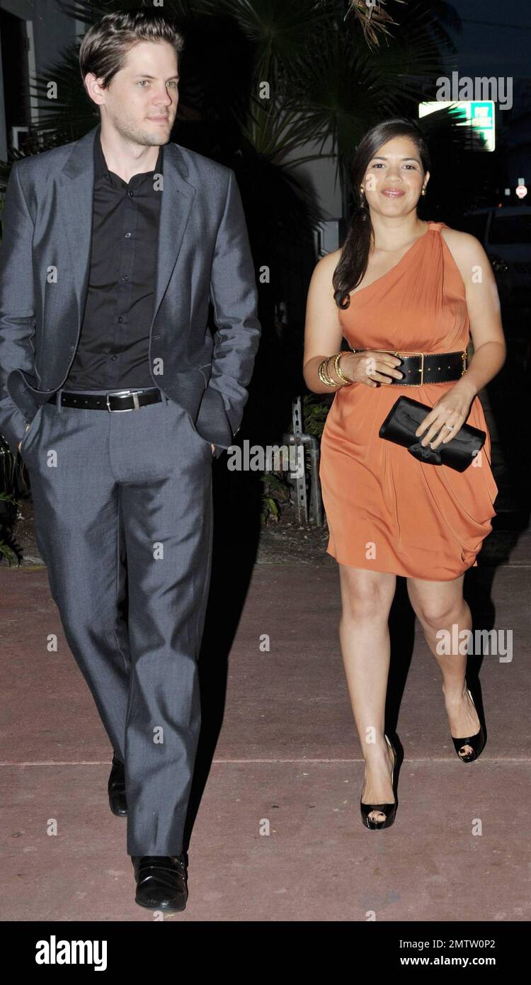 Clad in a flattering orange cocktail dress and wide belt, actress ...