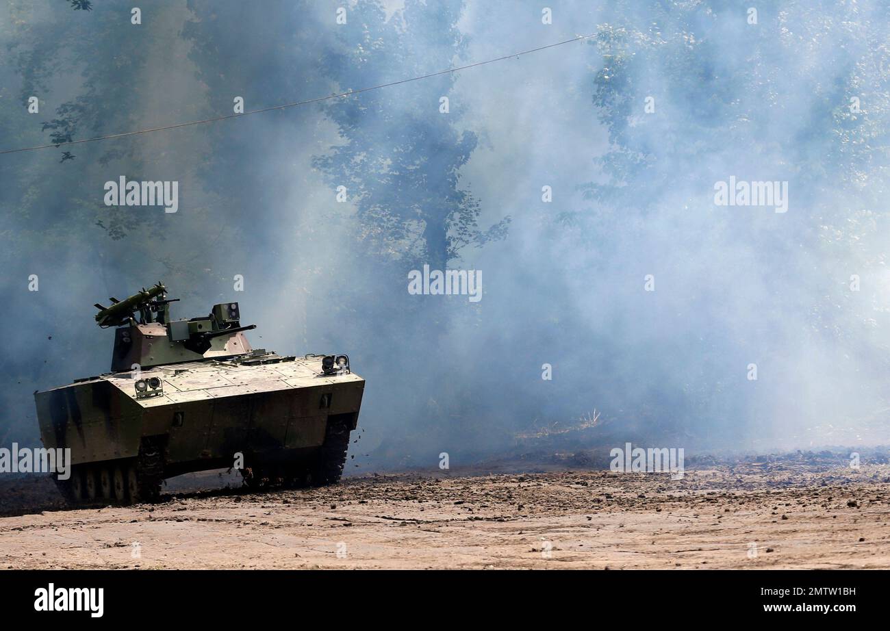 A Serbian army APC performs during exercise at a ceremony marking 72 ...