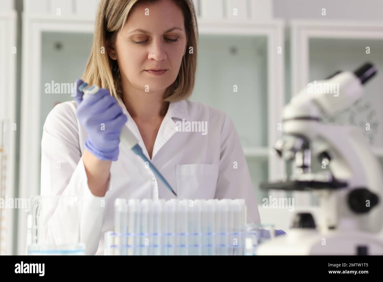 The woman makes tests in the laboratory, close-up Stock Photo - Alamy