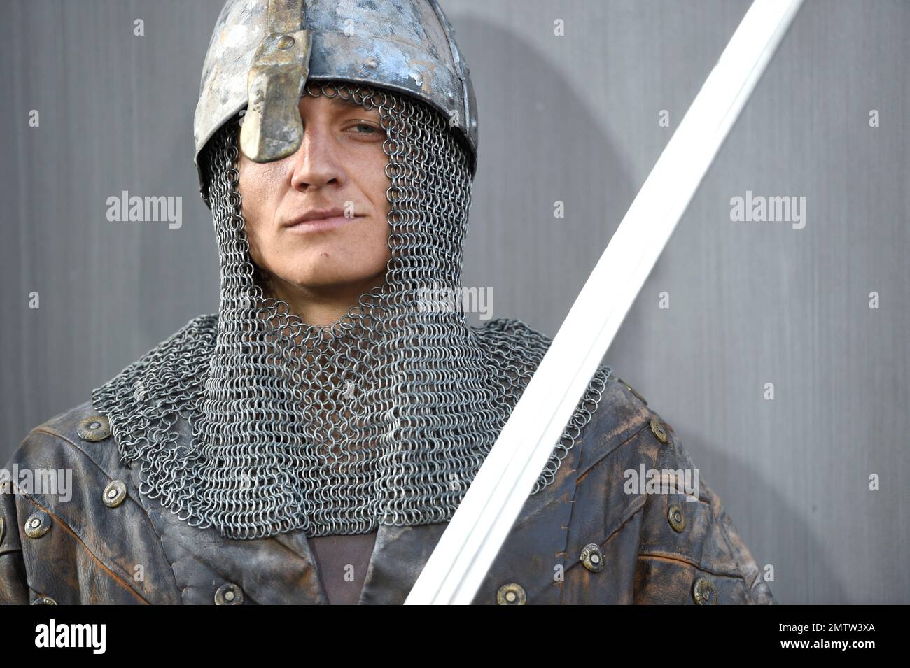 An actor dressed as a knight arrives at the world premiere of "King ...