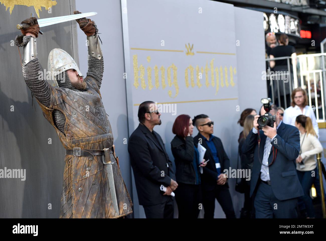 An actor dressed as a knight arrives at the world premiere of "King ...