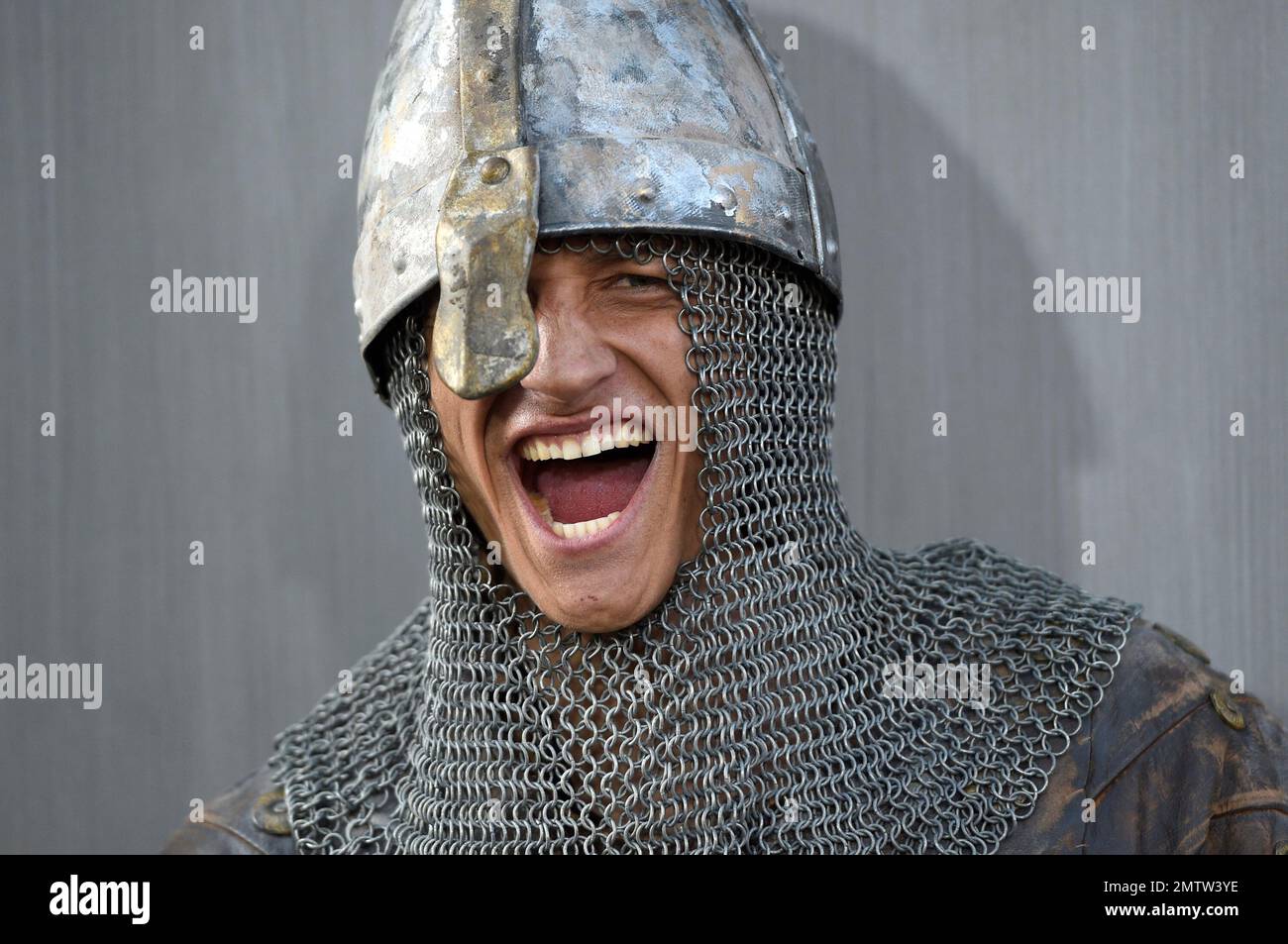 An actor dressed as a knight arrives at the world premiere of "King ...