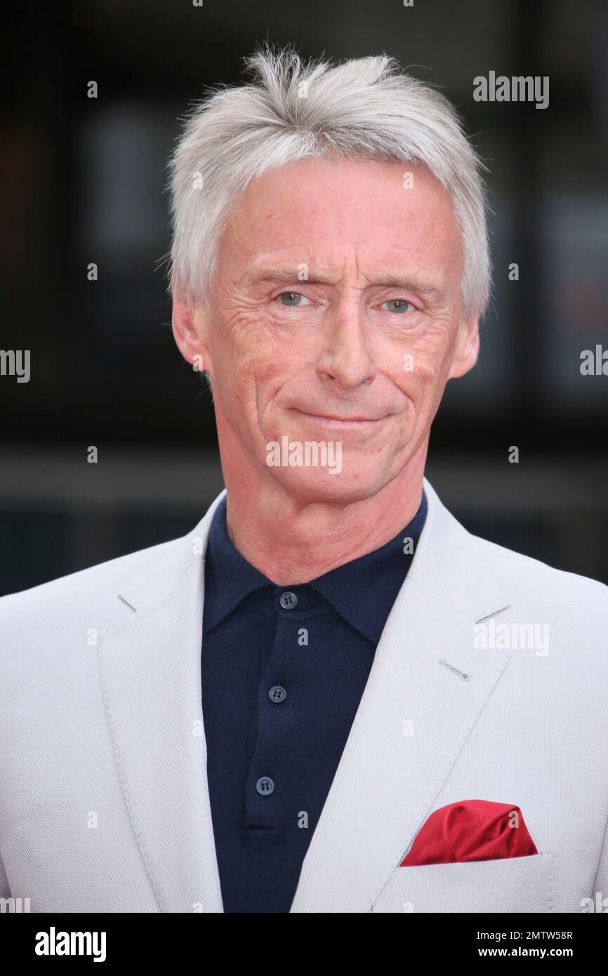 Singer Paul Weller poses for photographers upon arrival at the UK ...