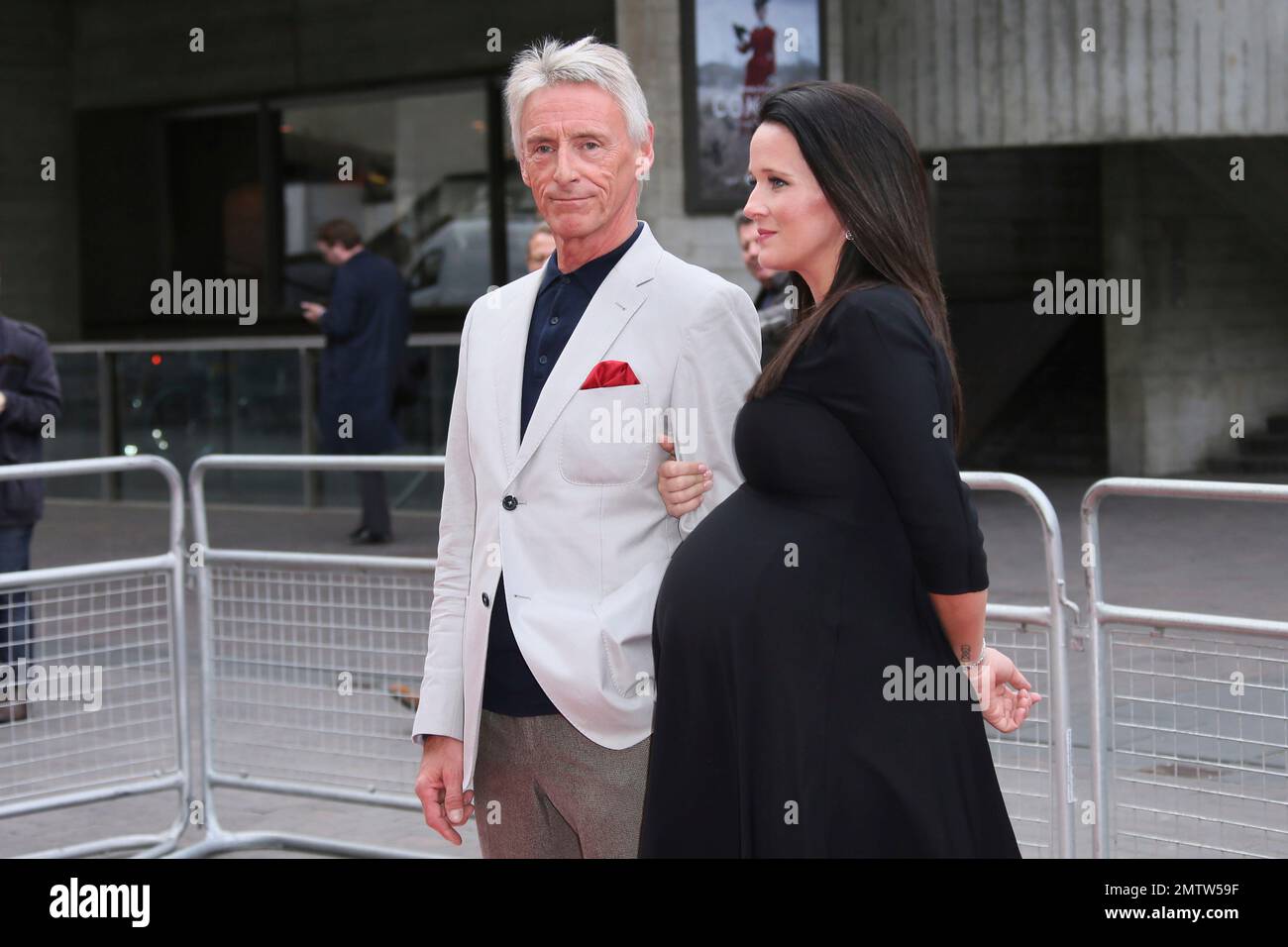 Singer Paul Weller and wife Hannah Andrews pose for photographers upon ...