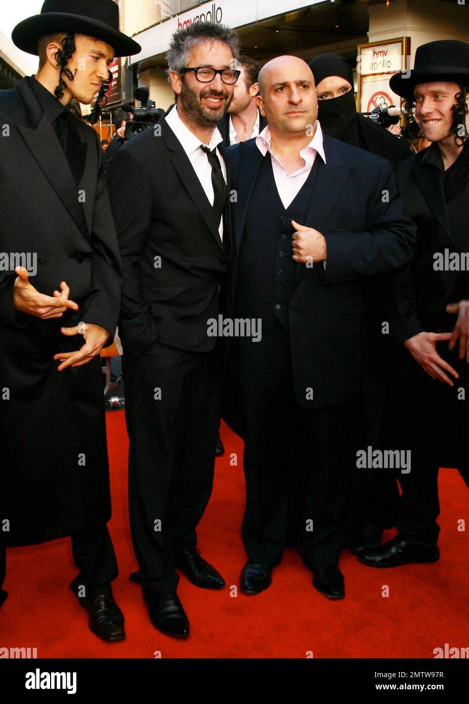 Writer David Baddiel and actor Omid Djalili pose on the red carpet with ...