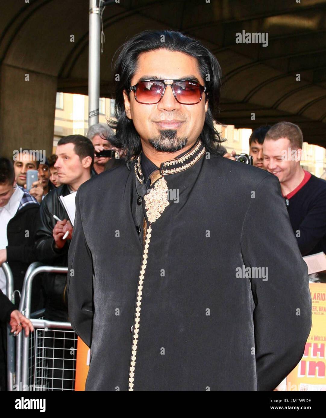 Producer Arvind Ethan David walks the red carpet at the world premiere ...