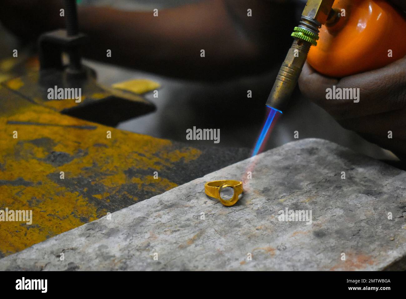 Kolkata, India. 01st Feb, 2023. A goldsmith works on a Gold ring at a ...
